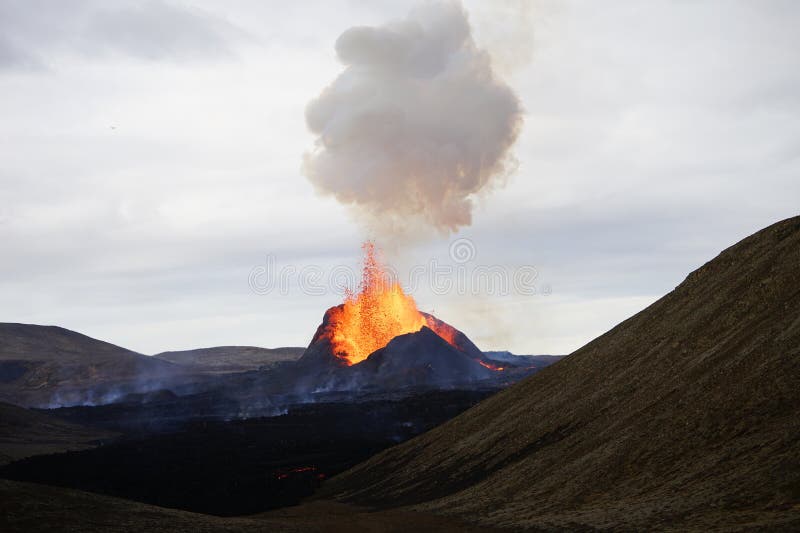 A Volcano Stormy in Iceland Stock Photo - Image of campfire, flame ...