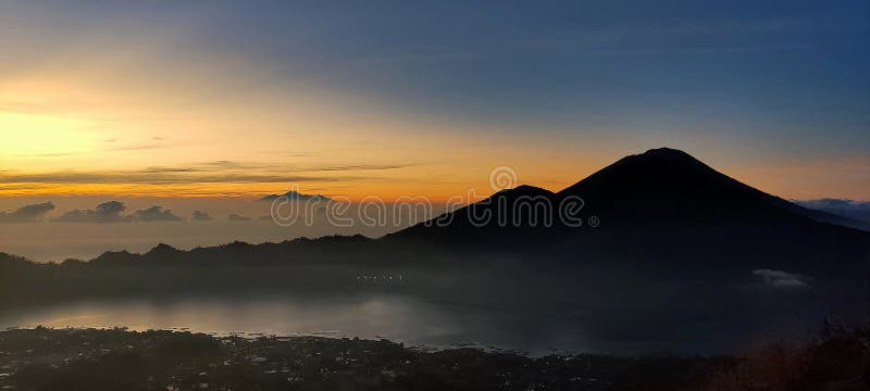 Volcano at sunrise stock photo. Image of dawn, mountain - 355981508