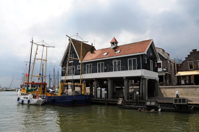 Fishing Vessels and on the Background Fish Auction in the Harbor of ...