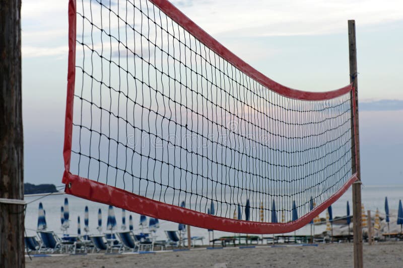 The Volleyball Net at the Beach. Stock Photo - Image of beach, parasols ...