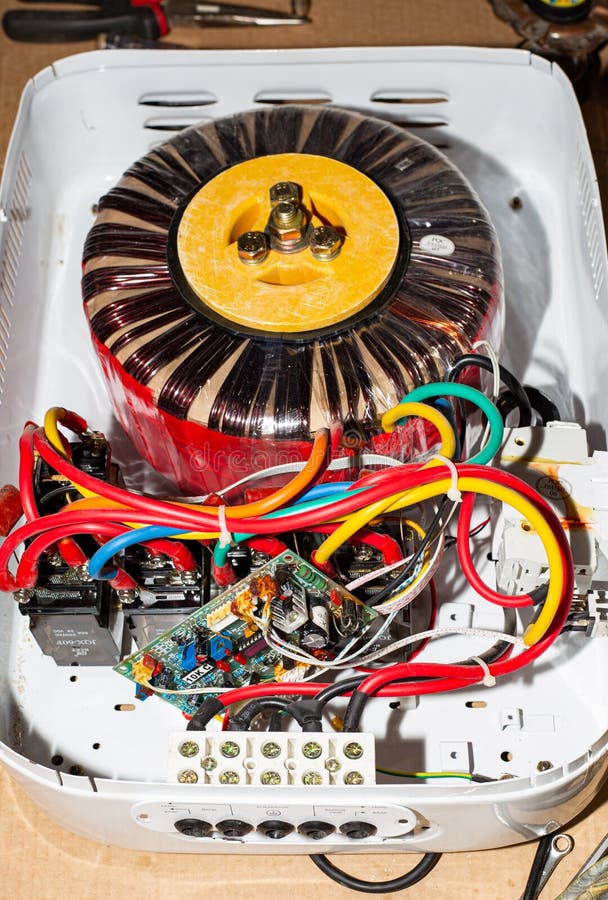 Voltage Stabilizer Repair. Multi-colored Wires in a White Casing of the ...