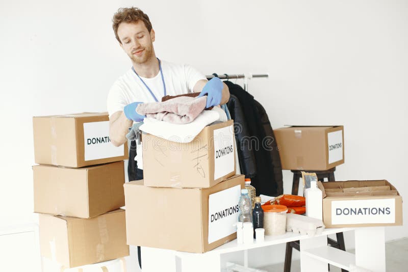 Volunteer Guy Packs Boxes with a Humanitarian Help Stock Image - Image ...