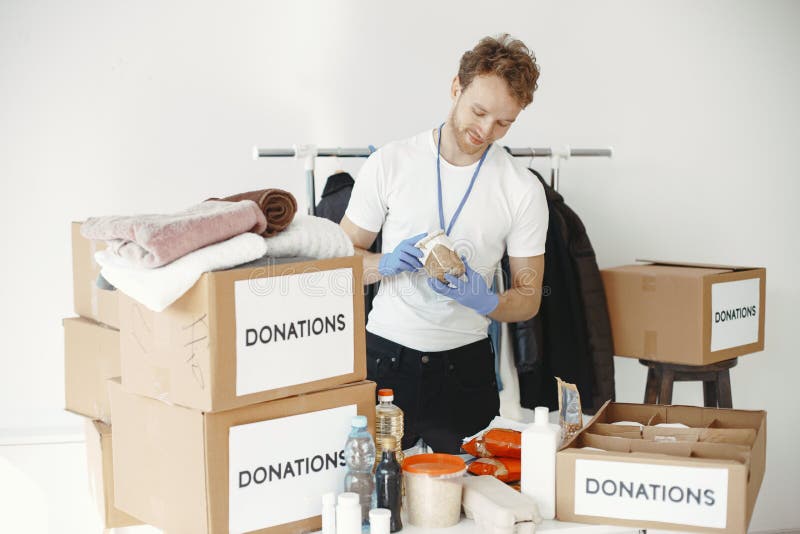 Volunteer Guy Packs Boxes with a Humanitarian Help Stock Image - Image ...