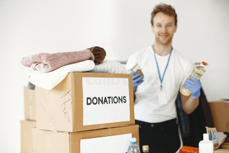 Volunteer Guy Packs Boxes with a Humanitarian Help Stock Image - Image ...
