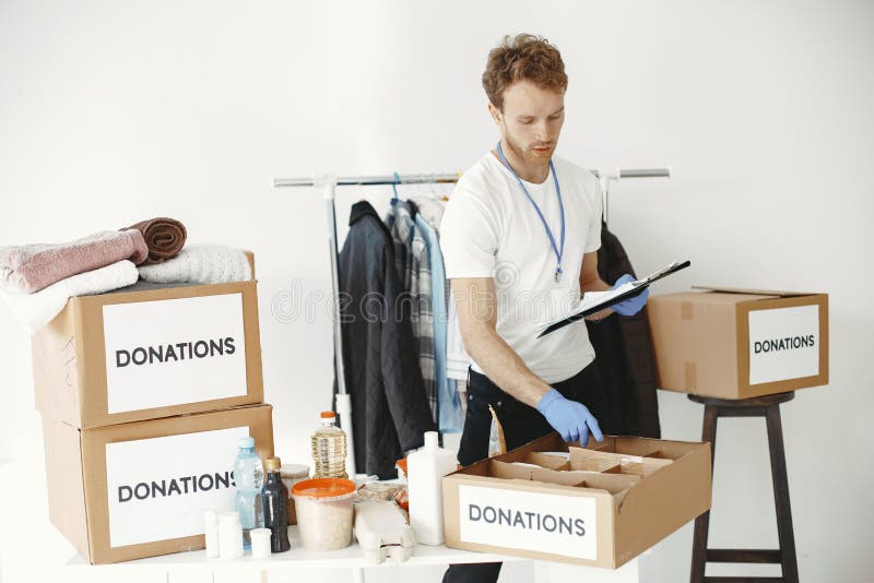 Volunteer Guy Packs Boxes with a Humanitarian Help Stock Image - Image ...