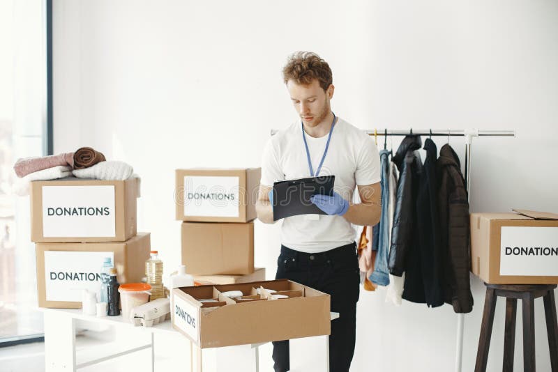 Volunteer Guy Packs Boxes with a Humanitarian Help Stock Image - Image ...