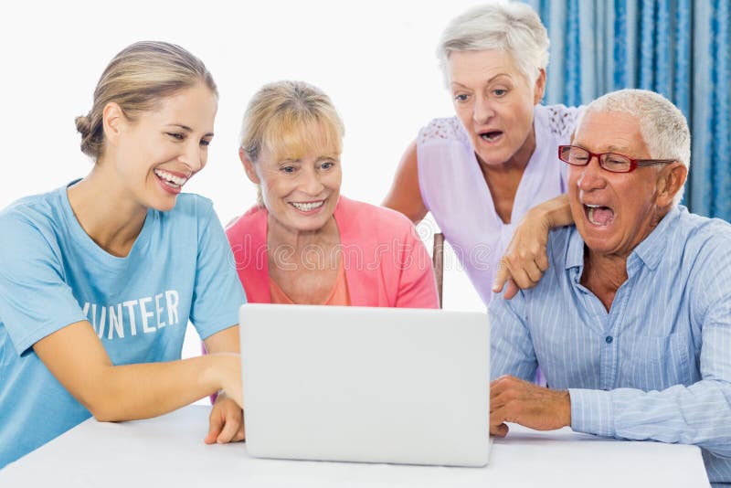 Volunteer and Seniors Using a Laptop Stock Image - Image of home ...