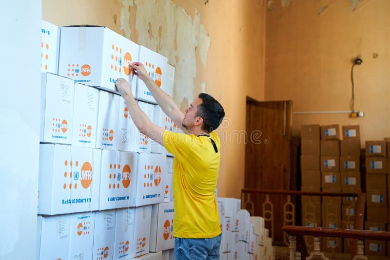 Volunteer Sorting Out Boxes with Humanitarian Aid Editorial Stock Image ...