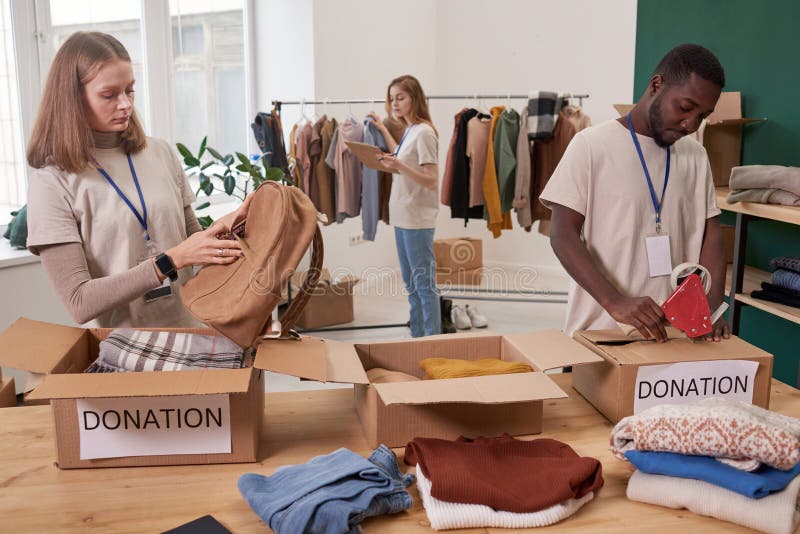 Volunteering in Clothes Charity Stock Photo - Image of lifestyles ...