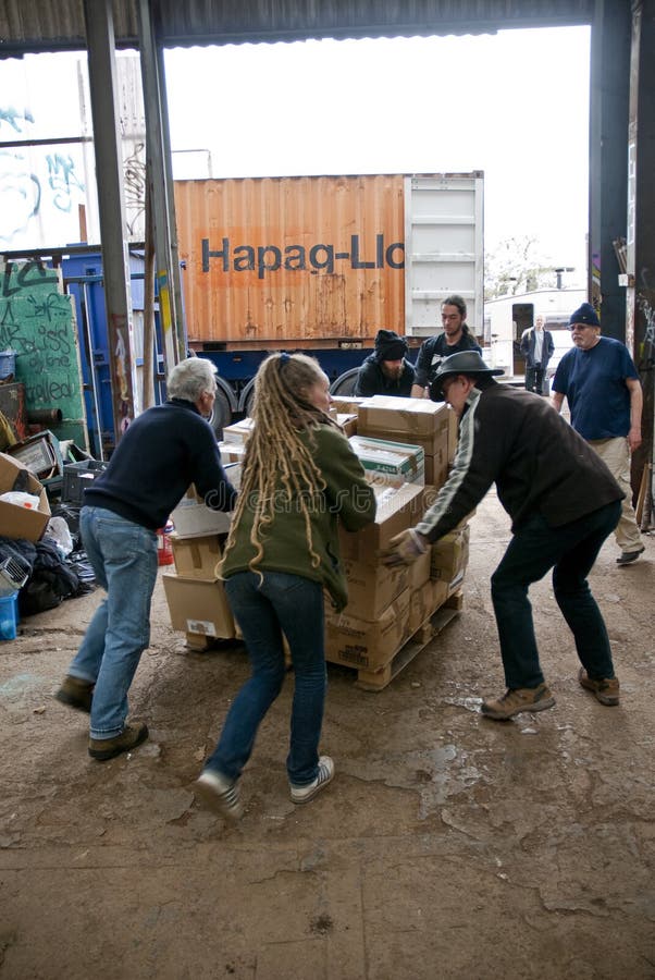Volunteers from BookCycle UK Push a Pallet of Books Editorial Image ...