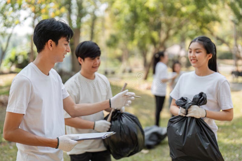 Volunteers Discussing Their Cleanup Efforts in a Park, Reinforcing ...