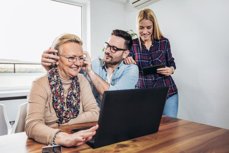 Volunteers Help Senior People on the Computer Stock Photo - Image of ...