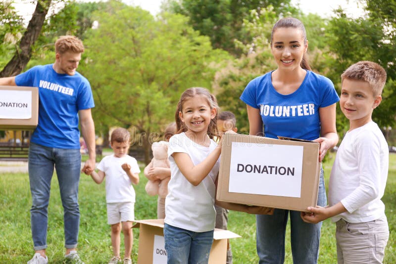 Volunteers and Kids with Donation Boxes Stock Photo - Image of goods ...