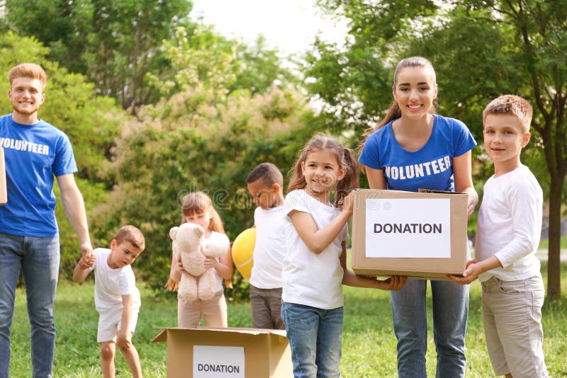 Volunteers and Kids with Donation Boxes Stock Photo - Image of ...