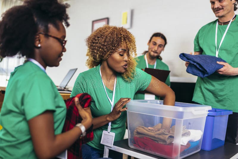 Volunteers Putting Clothes in Donation Boxes, Social Worker Making ...