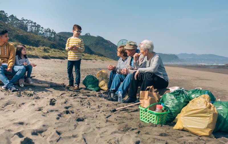 Volunteers Resting after Cleaning the Beach Stock Image - Image of ...