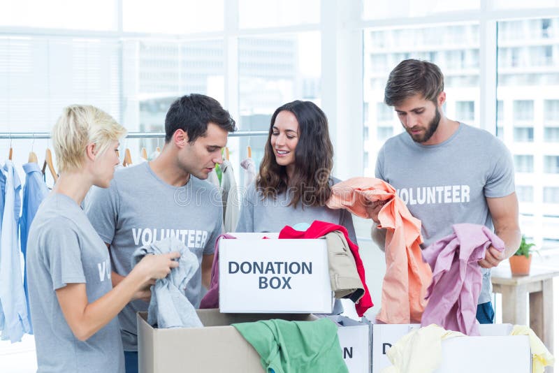 Volunteers Separating Donation Stuffs Stock Photo - Image of charity ...