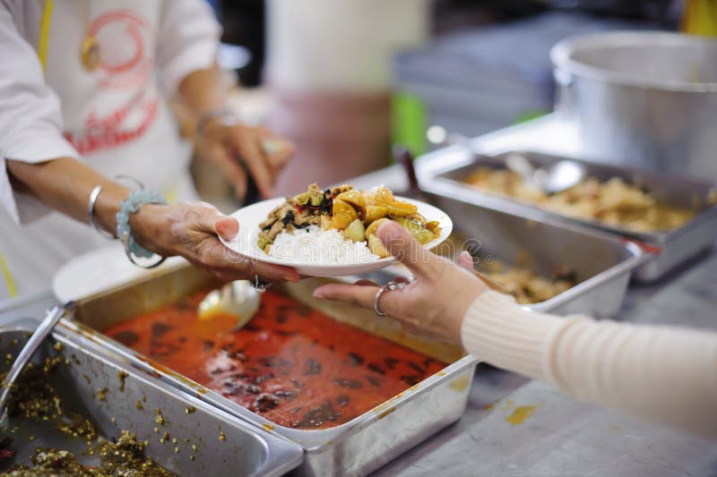 Volunteers Serving Food for Poor People : Food Sharing Concept Stock ...