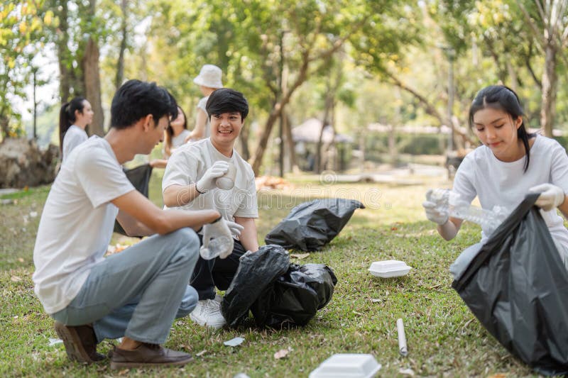 Dedicated Volunteers Sorting Trash during a Community Cleanup ...