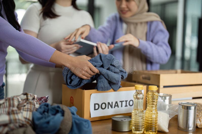 Volunteers Sorting Donations for a Sustainable Cause Stock Photo ...