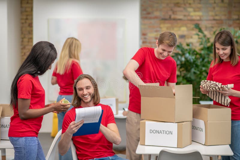 Volunteers Working in a Sorting Point and Looking Busy Stock Photo ...