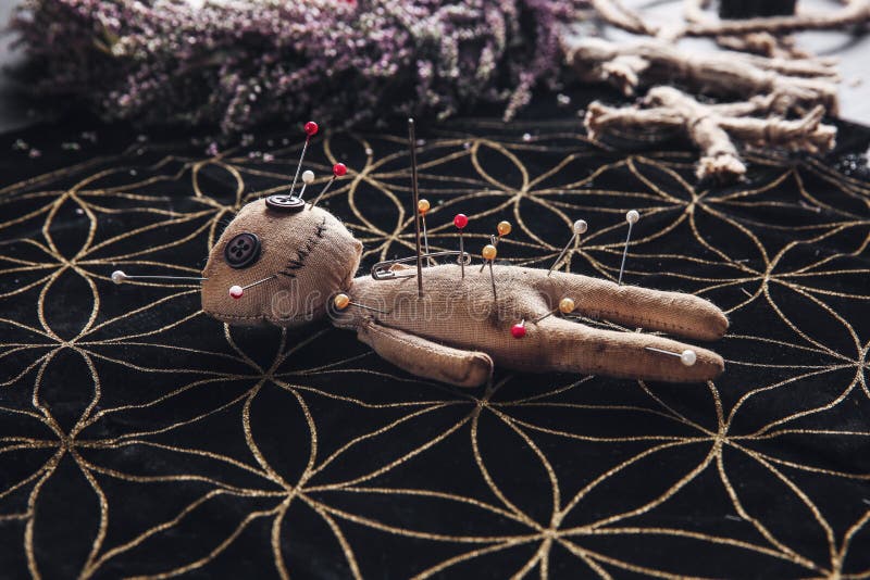 Voodoo Doll Pierced with Pins on Table. Curse Ceremony Stock Image ...