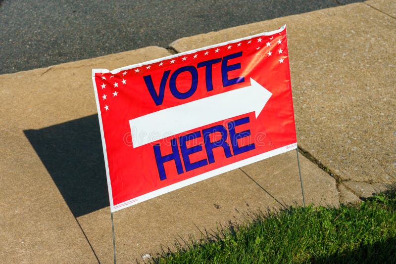 Vote Here Directional Sign stock image. Image of polling - 250119657