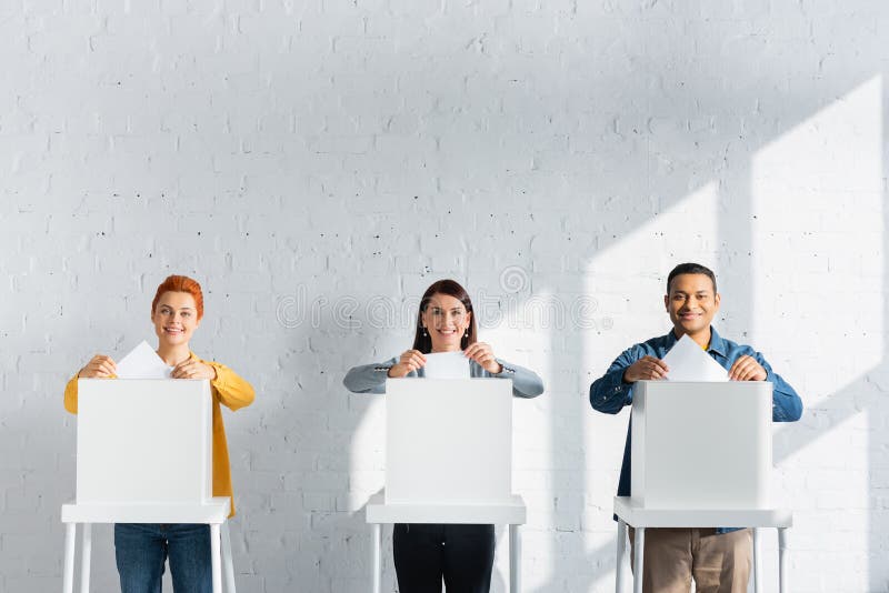 Voters Inserting Ballots into Polling Boxes Stock Image - Image of ...