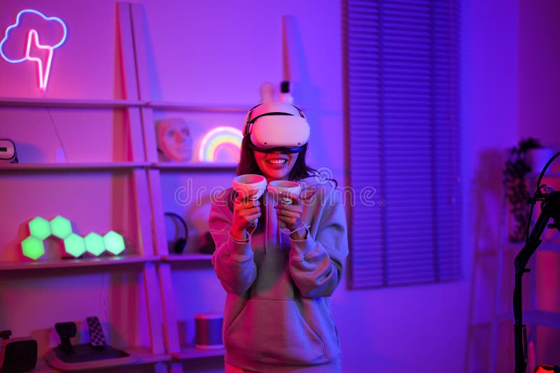 VR Joy when Asian Teenager Girl Playing Interactive Game Action or ...