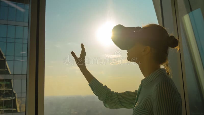 VR Concept - Young Woman Using Virtual Reality Headset Against ...
