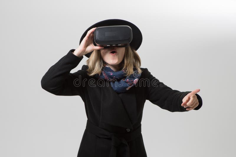 Woman Uses a Virtual Reality Glasses. VR 360. Virtual Game. Stock Photo ...