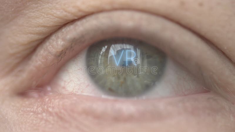 VR or Virtual Reality Text on Human Eye. Technology Related Macro Shot ...