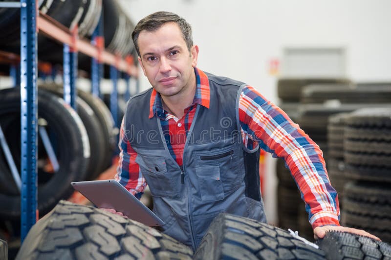 Vulcanizing Shop Worker Holding Clipboard Stock Image - Image of ...