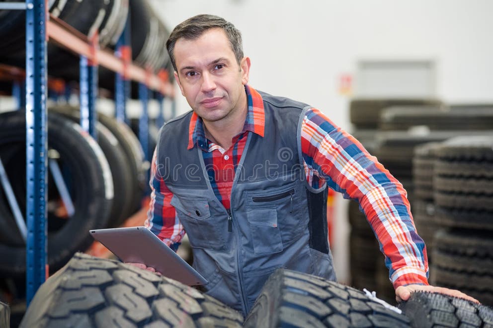 Vulcanizing Shop Worker Holding Clipboard Stock Image - Image of ...