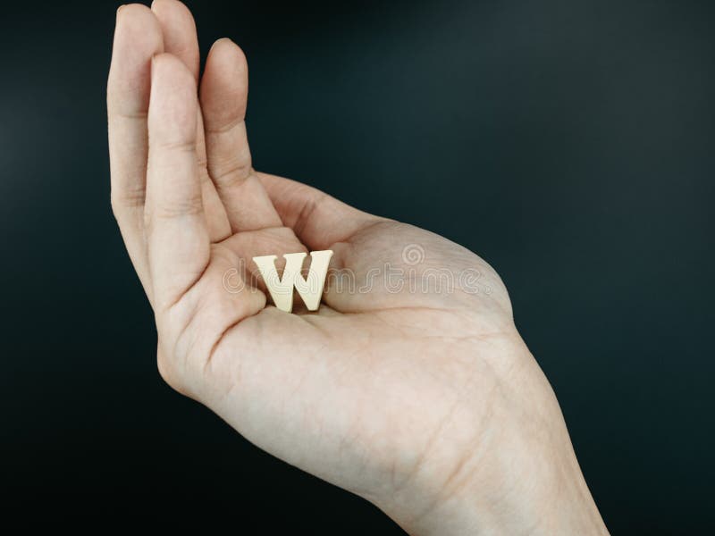 W Letter Hand Holding with Dark Background Stock Photo - Image of ...