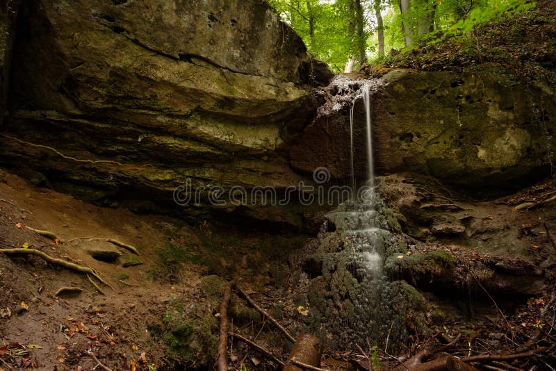 Waaterfall Falling Over a Rock in a Forest Stock Image - Image of ...