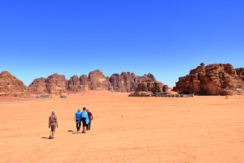 Wadi Rum, Jordan - May 15 2024: Tourists Hiking in the Wadi Rum Desert ...