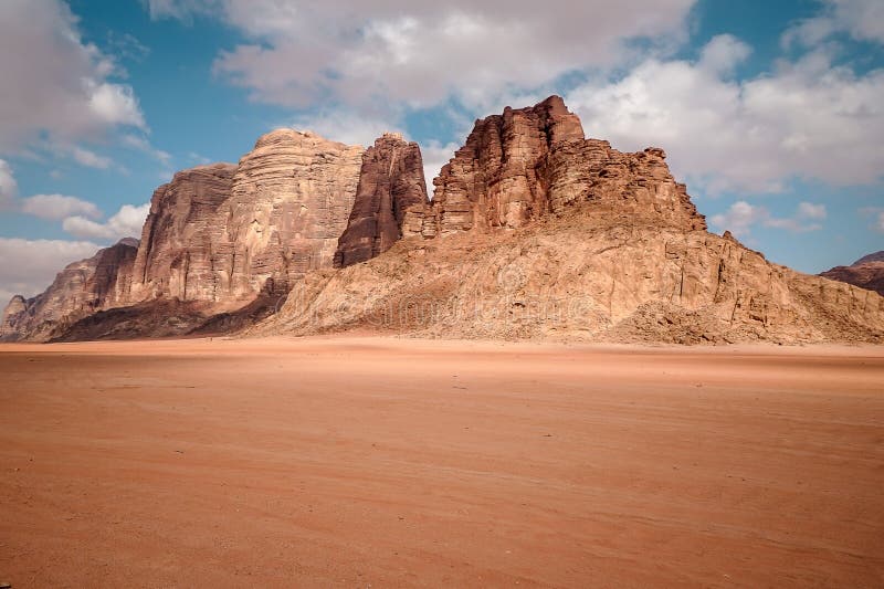 Wadi rum rocks and sand stock photo. Image of sandstone - 274656980
