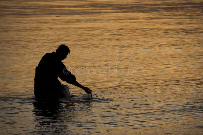 Man wading in lake or sea stock photo. Image of physique - 1108684