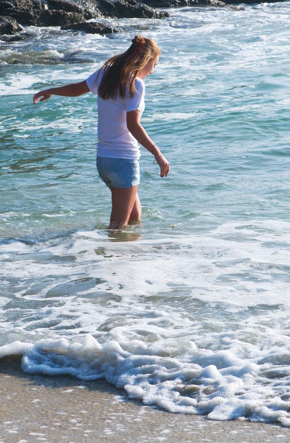 Wading in the Water stock photo. Image of ocean, woman - 15135944