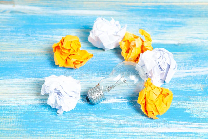 Wads of Paper and a Light Bulb Stock Photo - Image of light, bright ...