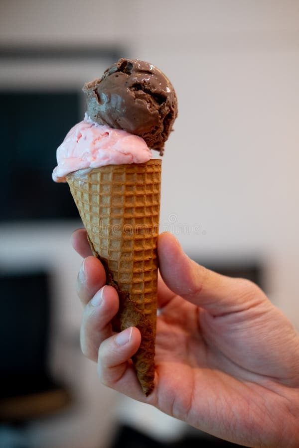 Wafer Cone With Two Scoops Of Ice Cream Strawberry And Chocolate Stock