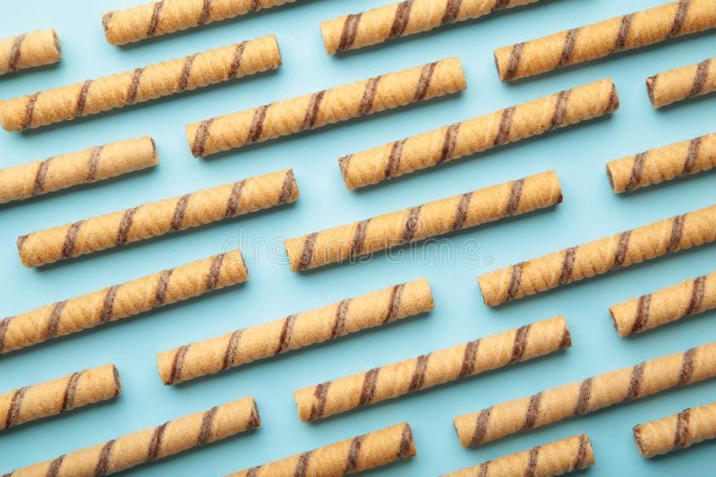Wafer Roll Sticks Cream Rolls on Blue Background. Minimalism Stock ...