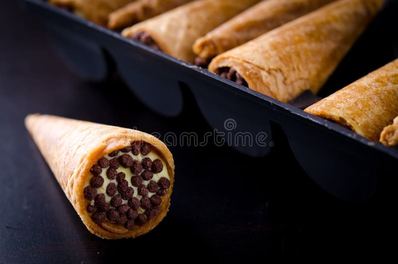 Wafer Rolls Filled with Butter Cream and Chocolate Crisps Stock Photo ...