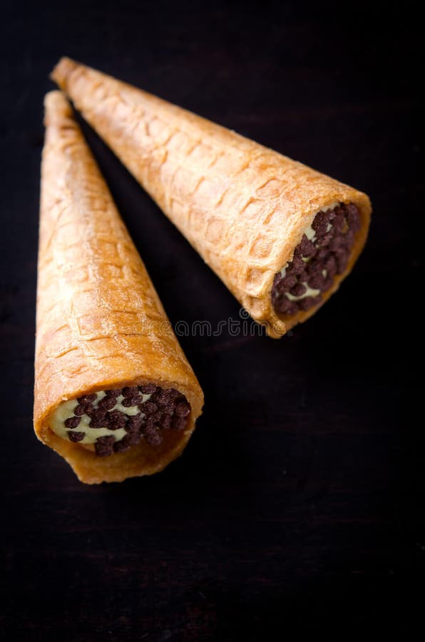 Wafer Rolls Filled with Butter Cream and Chocolate Crisps Stock Image ...