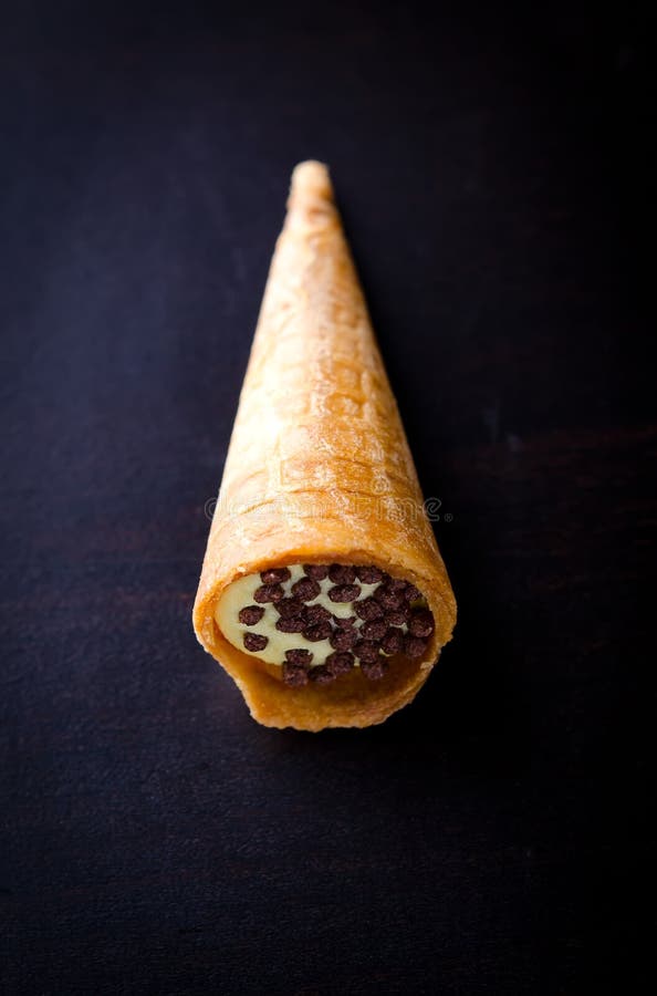 Wafer Rolls Filled with Butter Cream and Chocolate Crisps Stock Photo ...