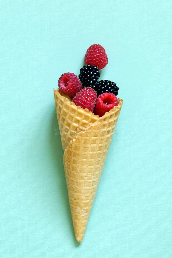 Waffle cone with berries stock photo. Image of sweet - 286540164