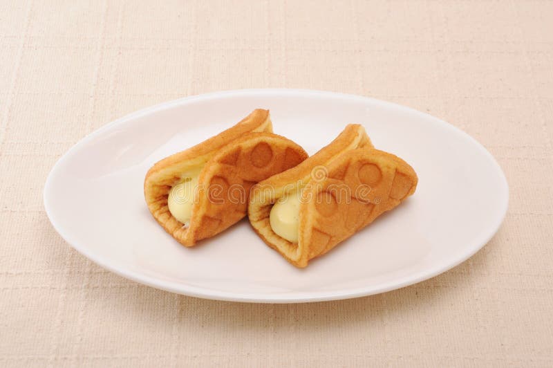Waffle Custard Cream Roll on Plate on Table Stock Photo - Image of ...