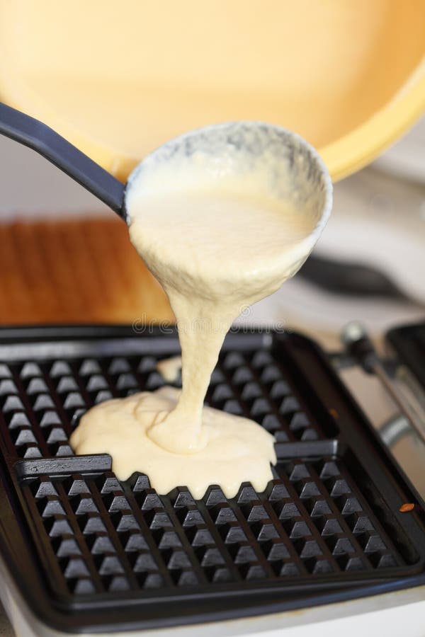 Waffle Iron Preparing Waffles in Kitchen Stock Photo - Image of ladle ...
