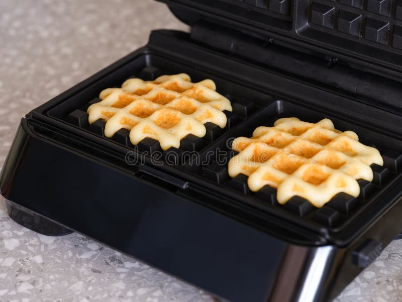 A Waffle Maker with Two Gluten-free Homemade Waffles Inside of it ...
